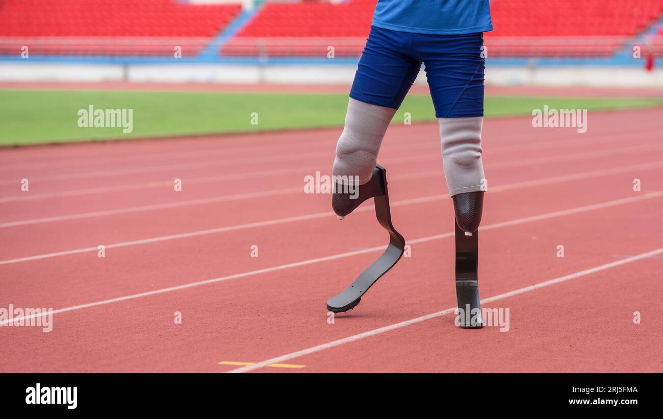 An Asian paralympic athlete equipped with prosthetic running blades ...