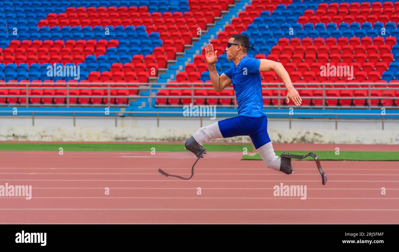 An Asian paralympic athlete equipped with prosthetic running blades ...