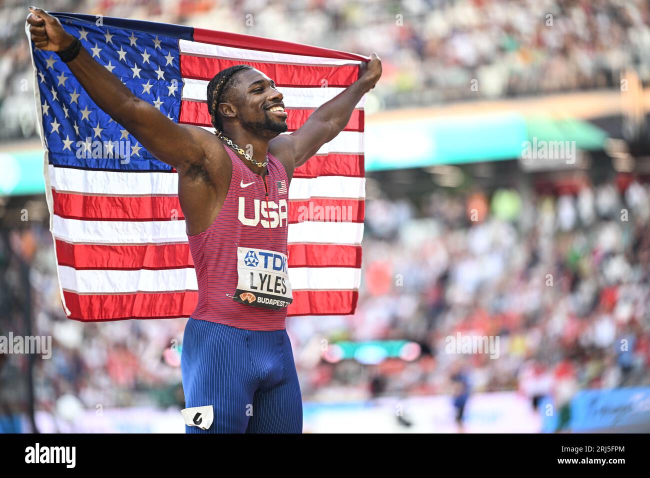 Noah Lyles Celebrating Her Victory With The Usa Flag In The 100 Meters At The World Athletics
