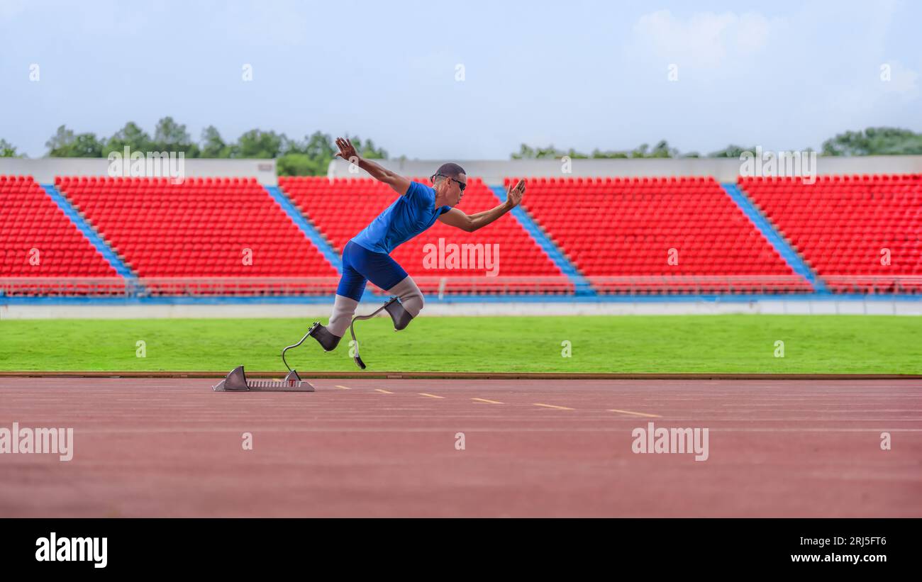 An Asian paralympic athlete equipped with prosthetic running blades ...