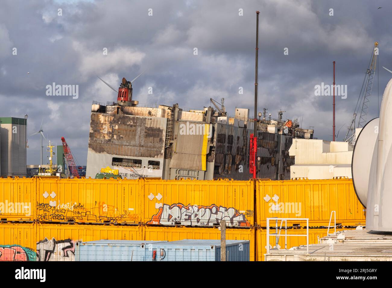 A burnt-out transport ship (The Freemantle Highway) carrying thousands ...