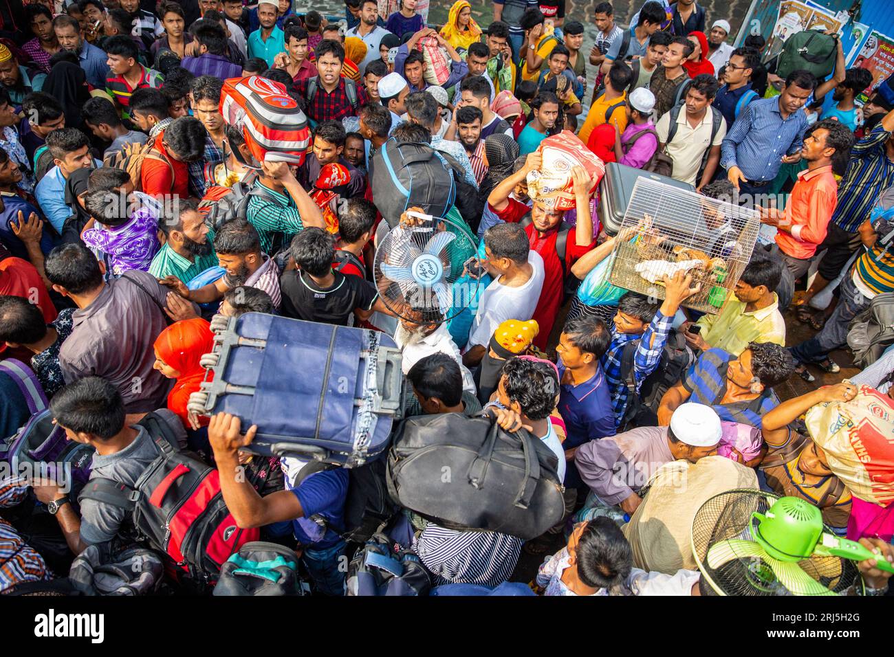Sadarghat Launch Terminal sees a huge crowd of people bound for their ...