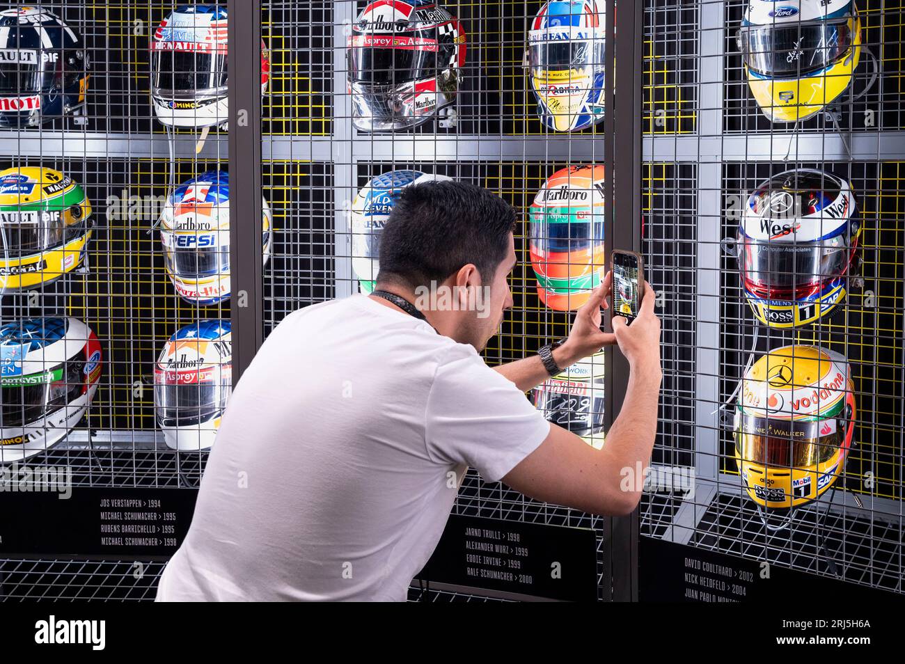 Madrid, Spain. 19th Aug, 2023. A visitor takes a photo of displayed F1 ...