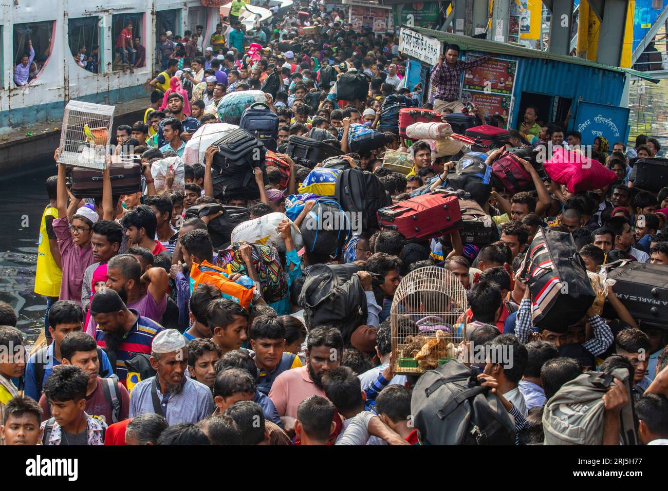 Sadarghat Launch Terminal sees a huge crowd of people bound for their ...