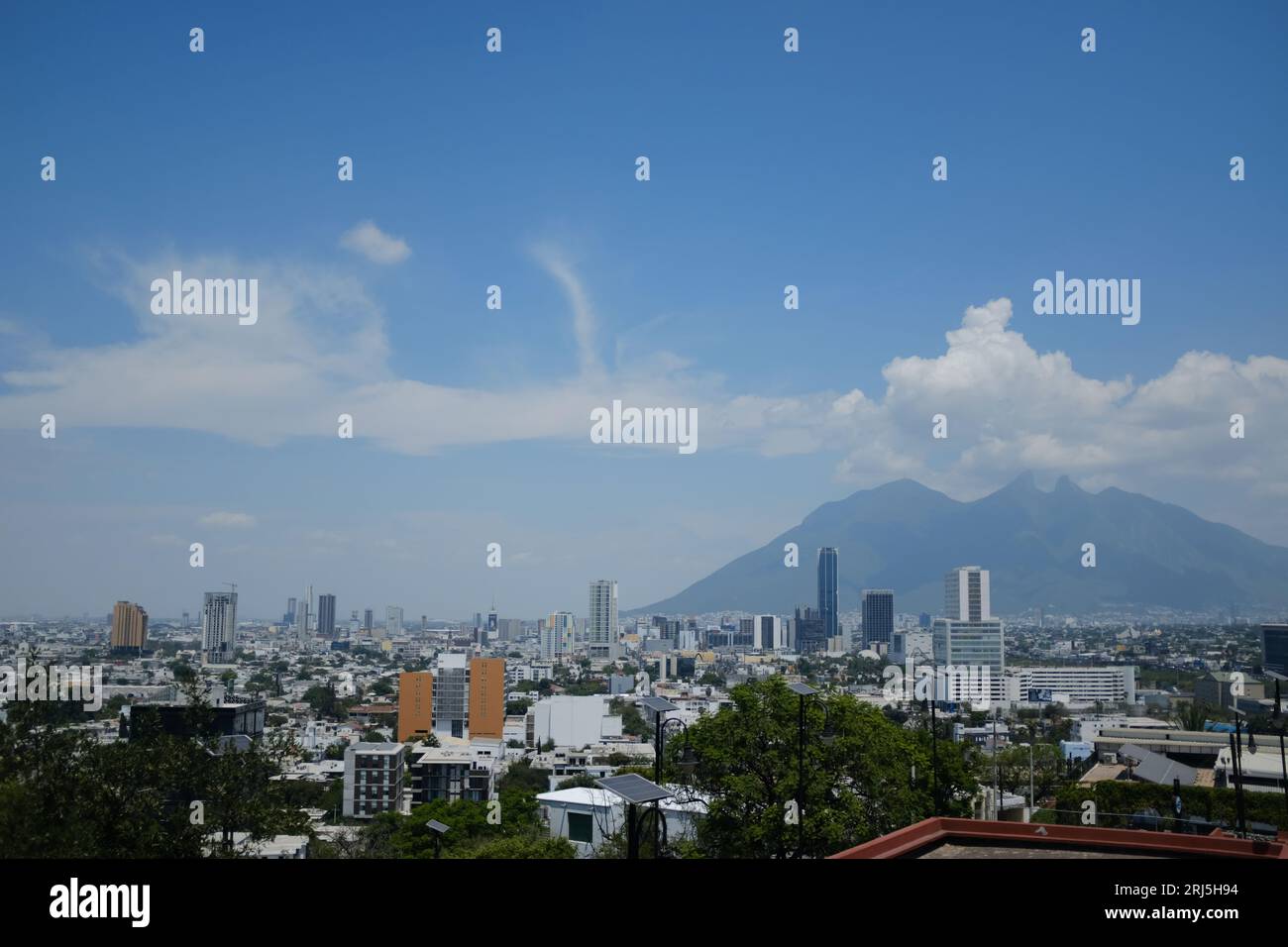 The skyline of Monterrey with Cerro de la Silla mountain in the ...