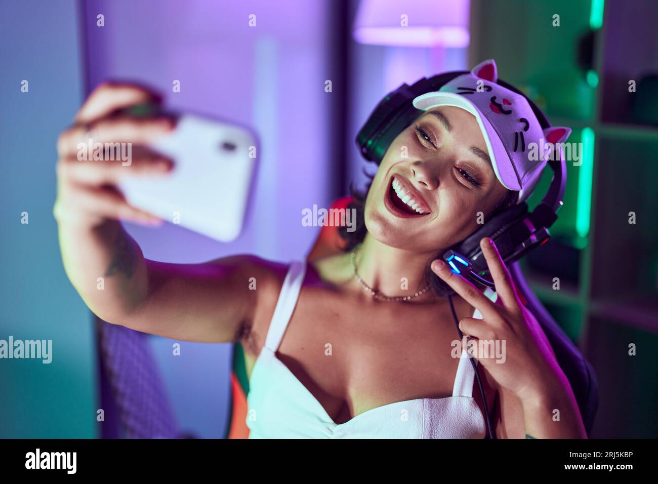 Young beautiful hispanic woman streamer smiling confident make selfie ...