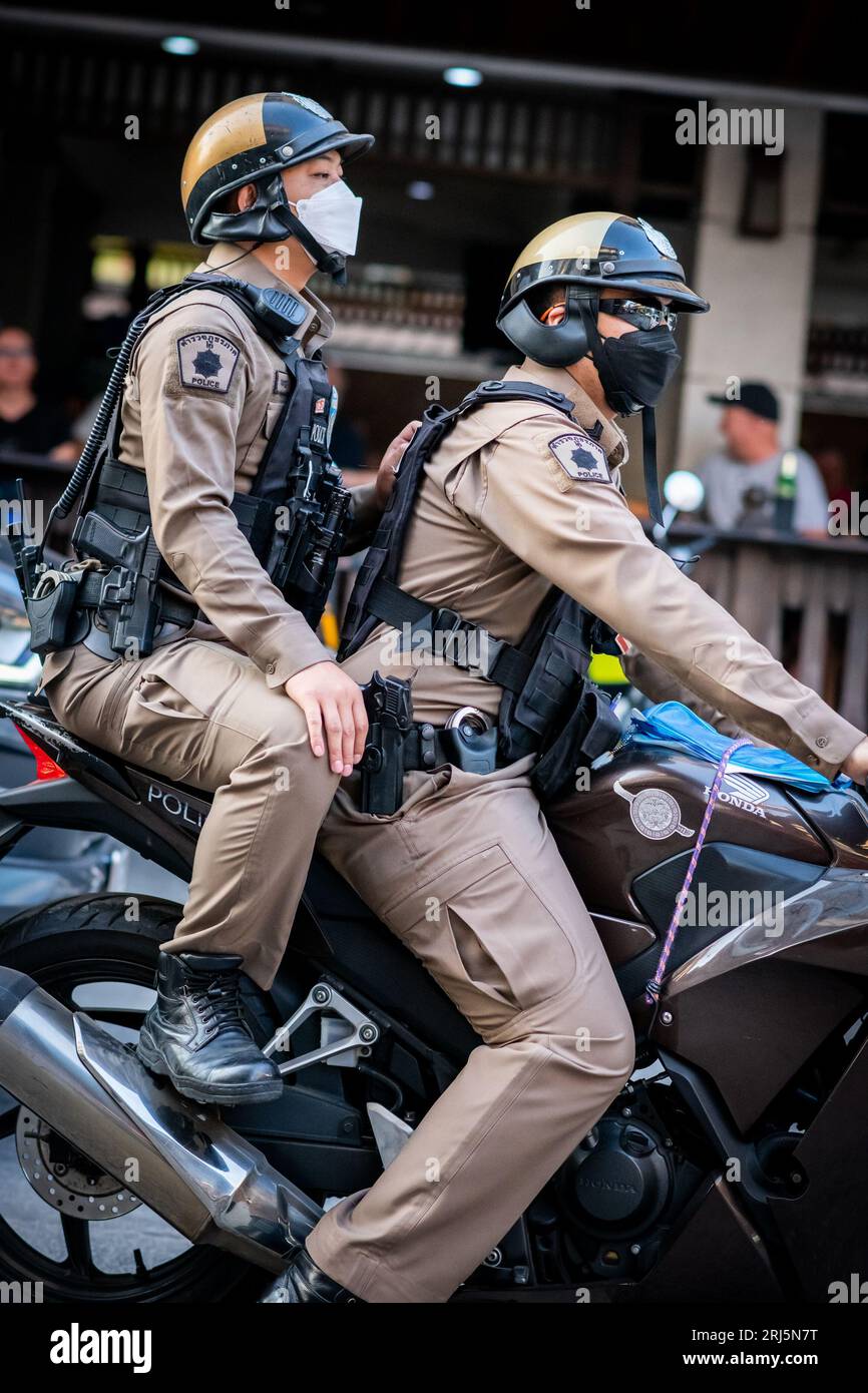 Two Thai police head along Soi Buakhao, Pattaya on their motorbike ...