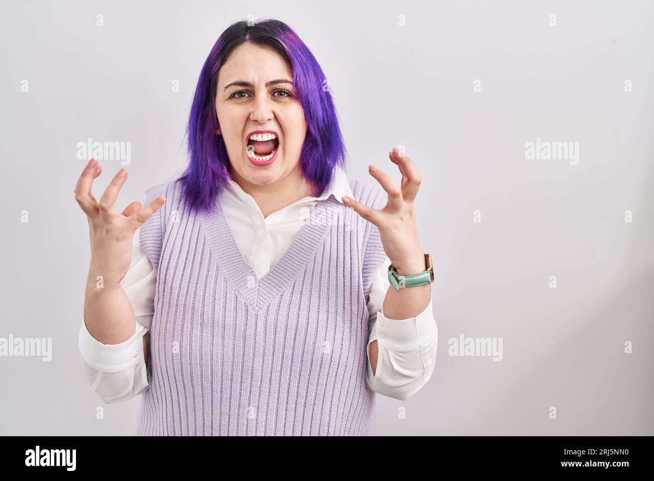 Plus size woman wit purple hair standing over white background crazy ...