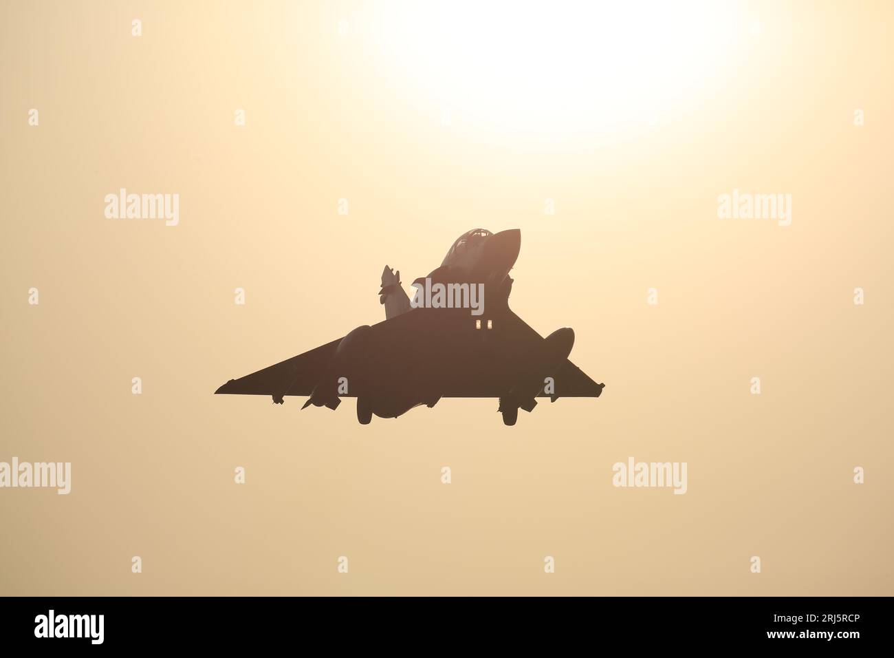 A Mirage 2000 flying in the sky with its landing gear deployed, ready ...