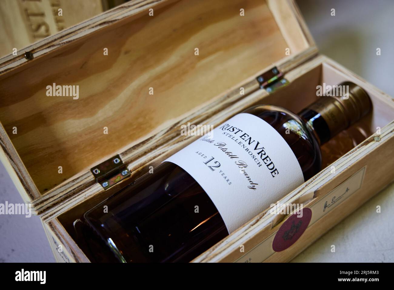 A bottle of Rust en Vrede wine in a small wooden carrying case Stock ...