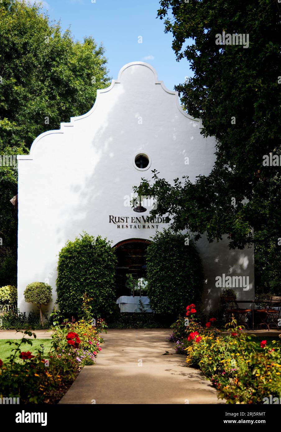 The Rust en Vrede Wine Estate surrounded by lush greenery Stock Photo ...