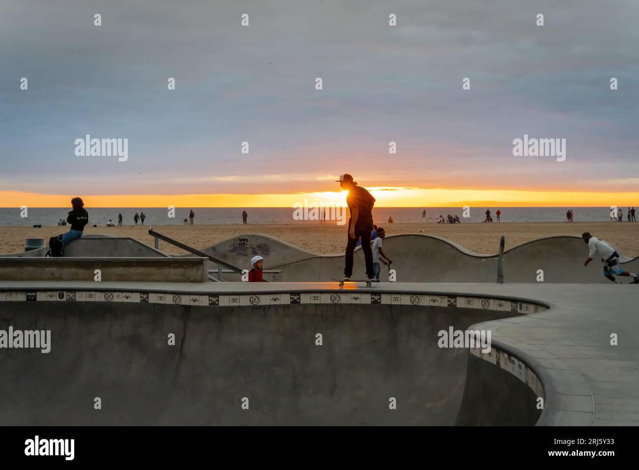 A scenic view of a scenic skate park full of skateboarders next to the ...
