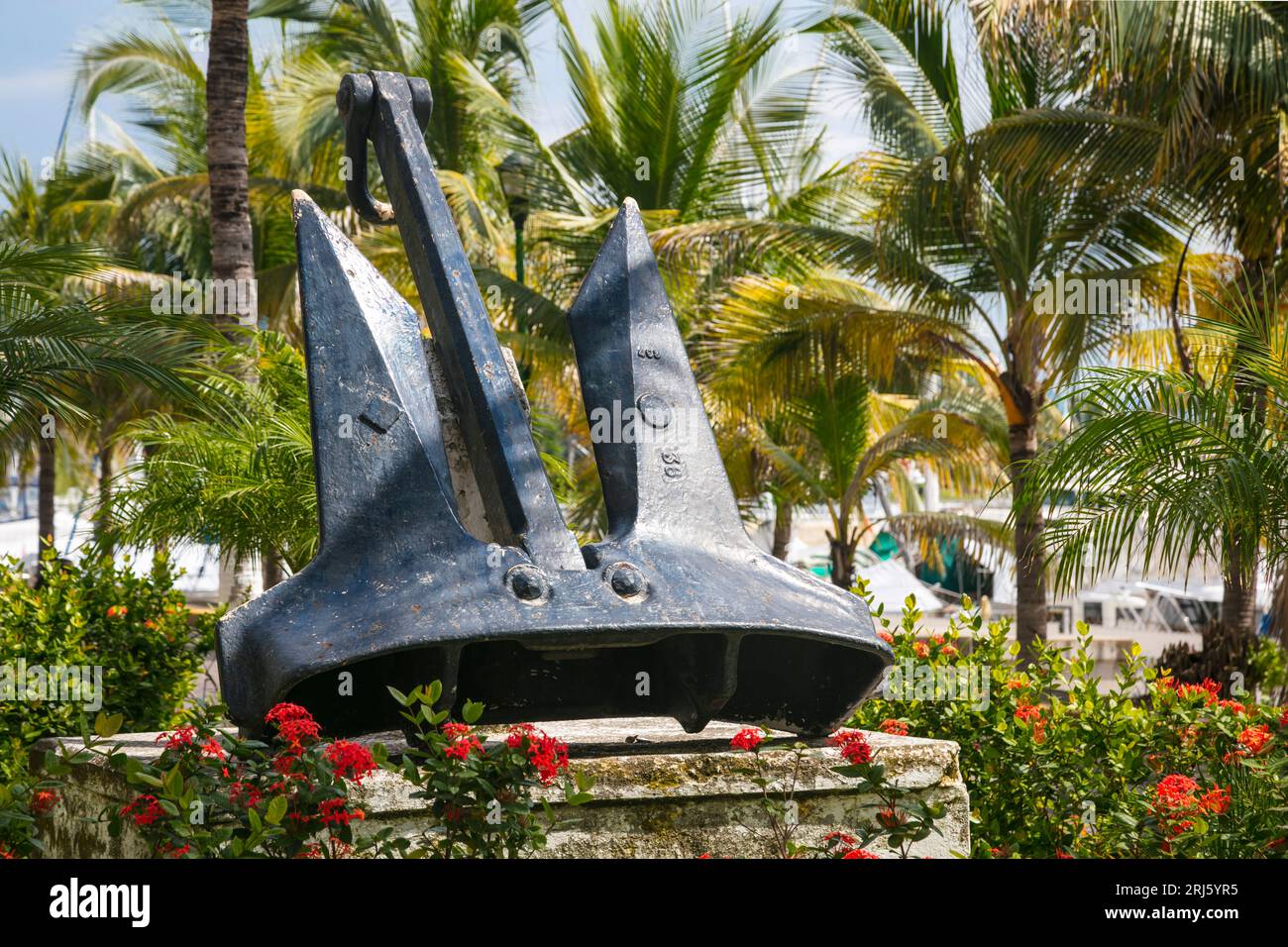 A scenic view of an anchor statue in a green garden of Nuevo Vallarta ...