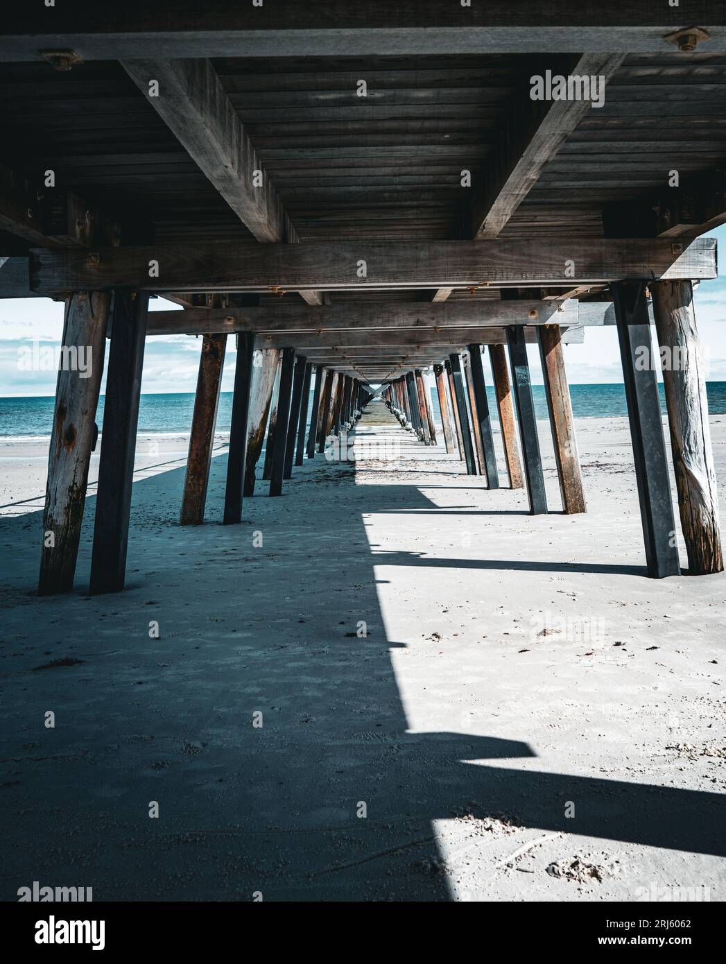 A wooden structure stands on a sun-drenched beach Stock Photo - Alamy