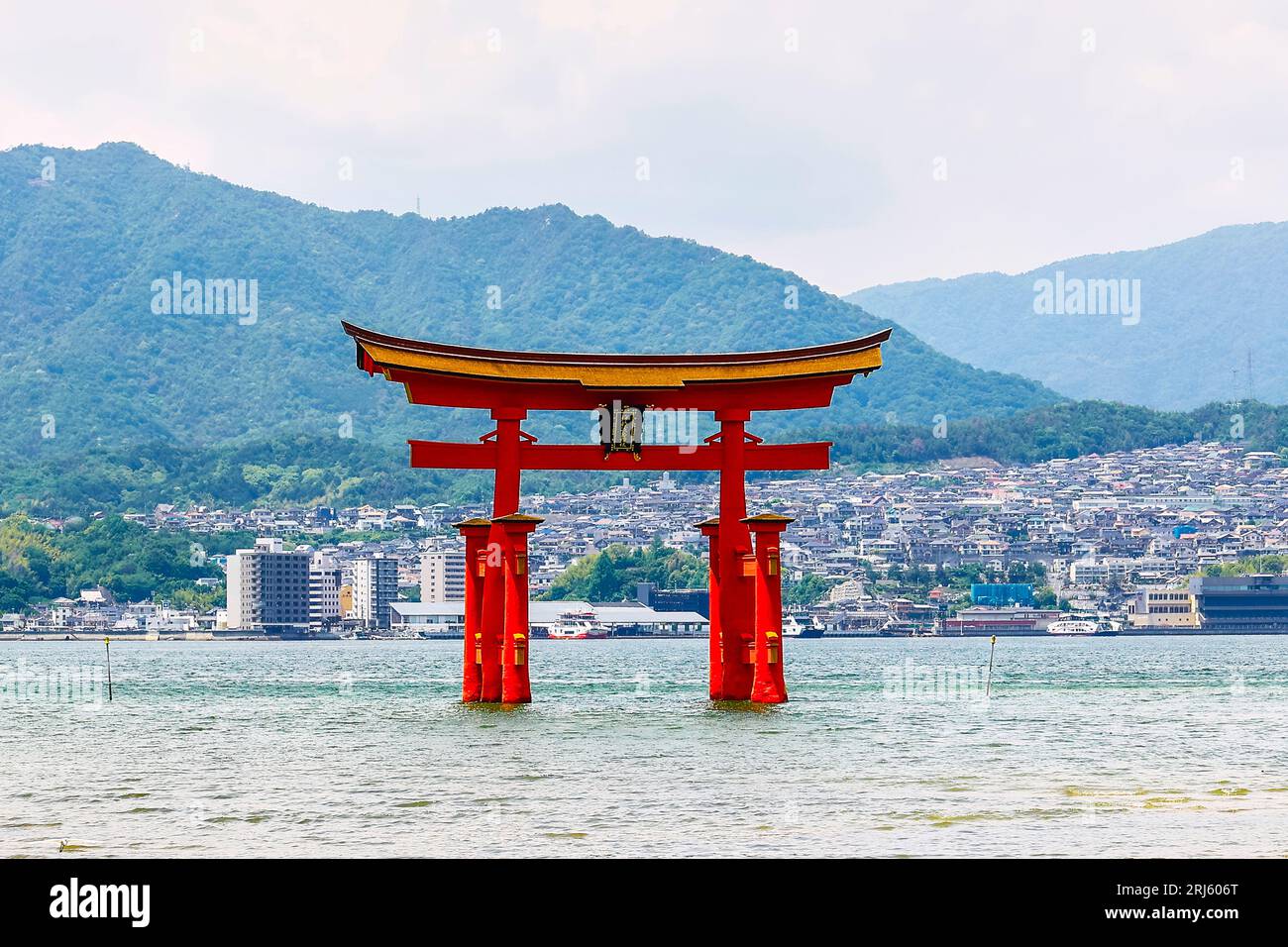 A majestic landscape view of the red Torii gate floating in the water ...