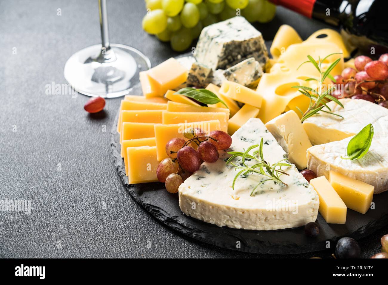 Cheese platter with craft cheese assortment on slate board Stock Photo ...