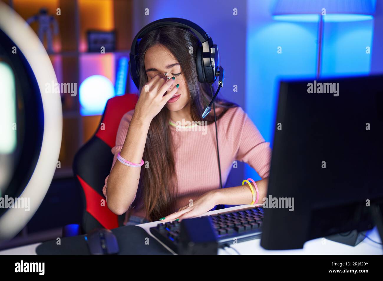 Tired female gamer playing video games hi-res stock photography and ...
