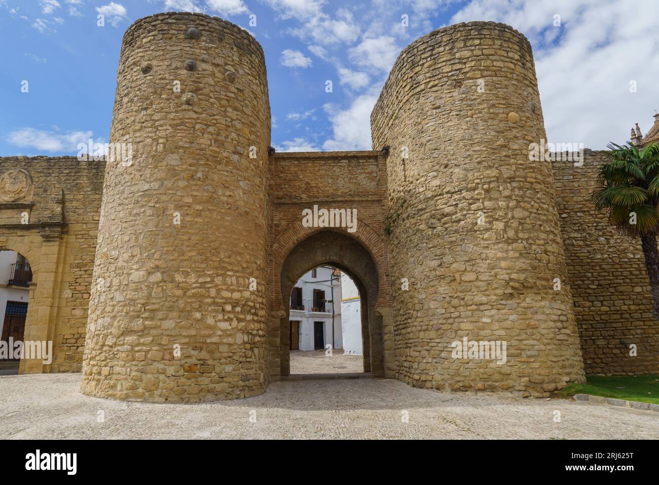 defensive walls of the city of ronda ,almocabar gate and church of the ...