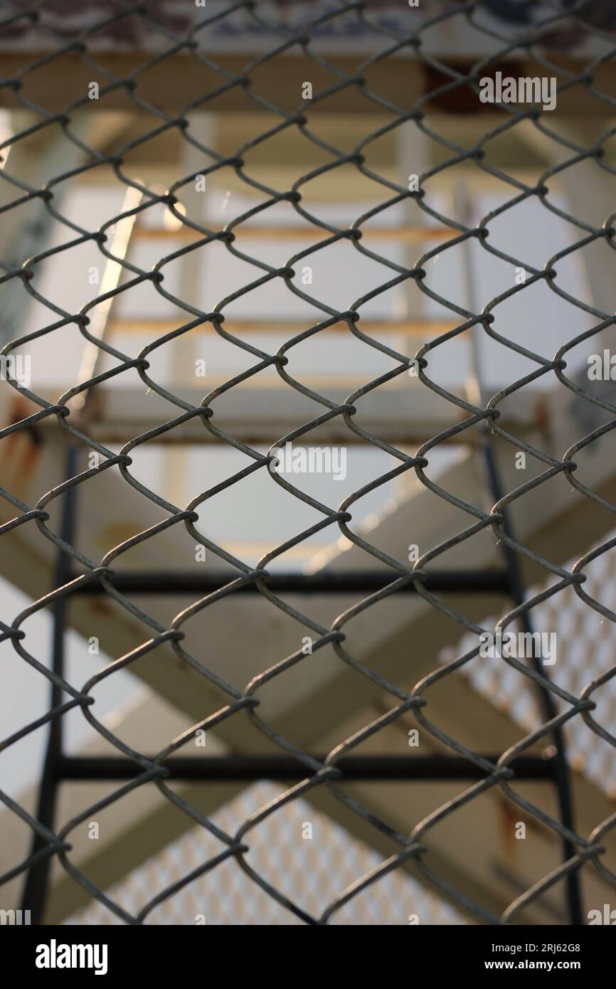 Industrial metal chain link fence with a typical repeating pattern ...