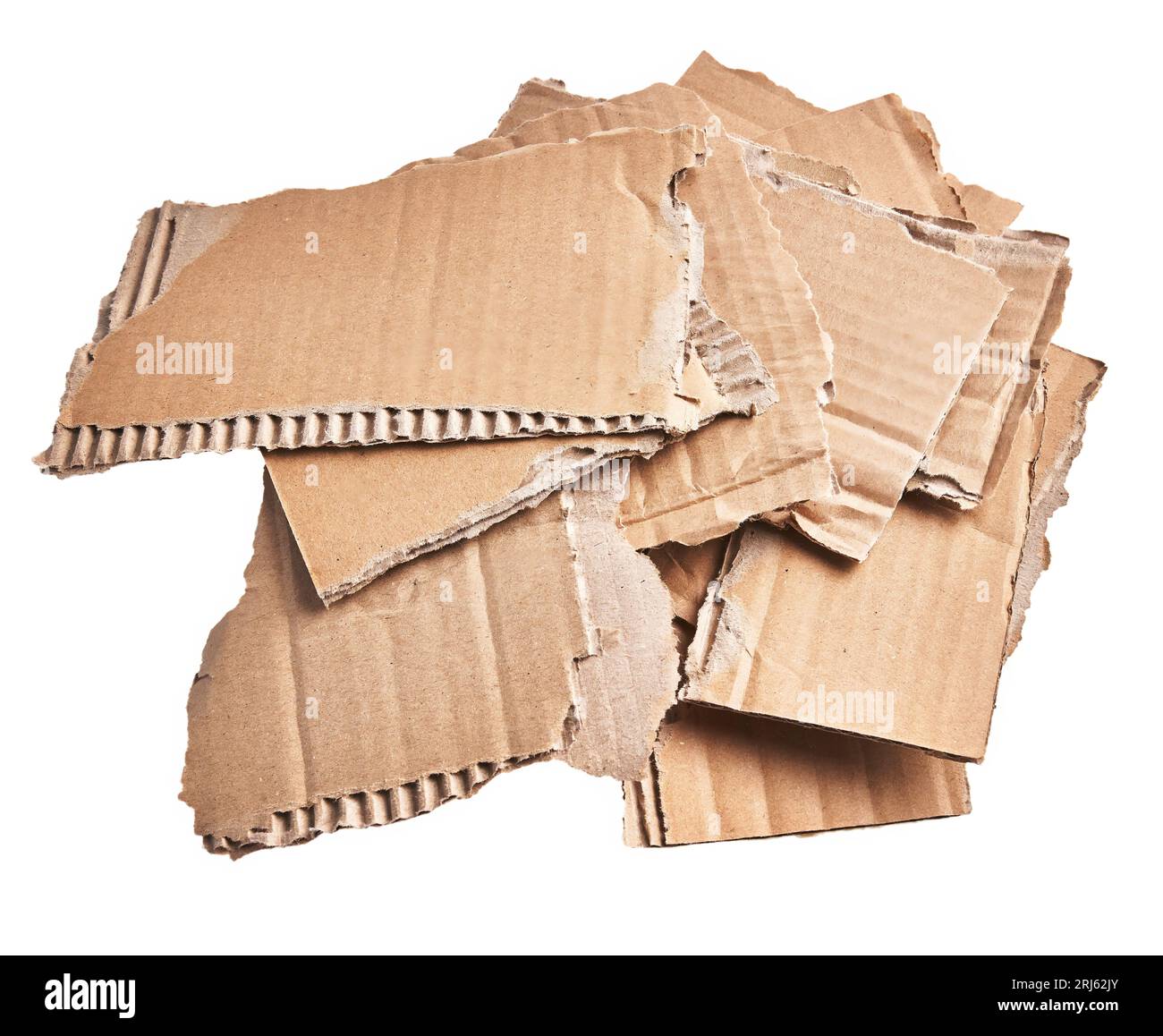 Stack of ripped pieces of cardboard material over isolated white ...
