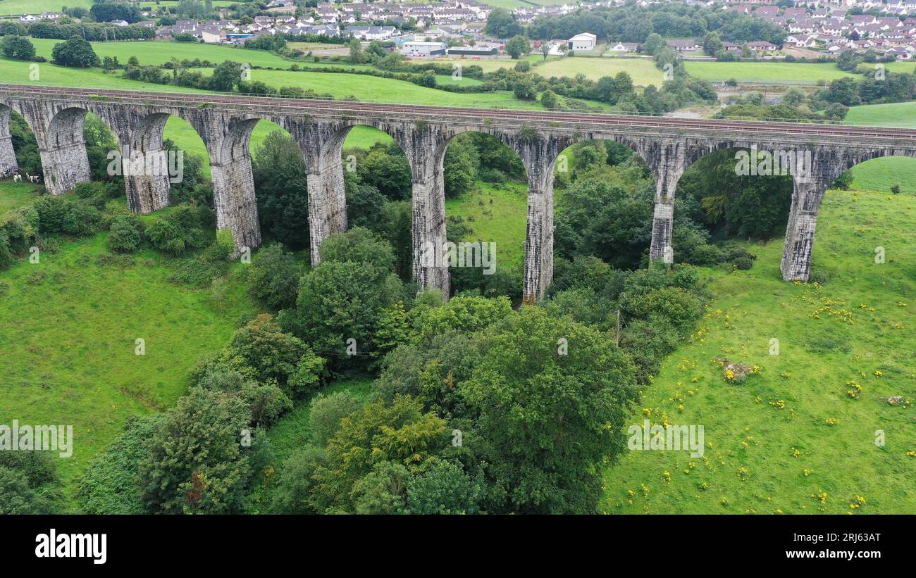 An aerial view of a beautiful mountainous landscape with a bridge in ...