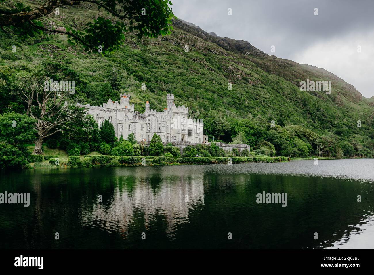 Kylemore Abbey castle in Ireland with water in foreground and castle on ...