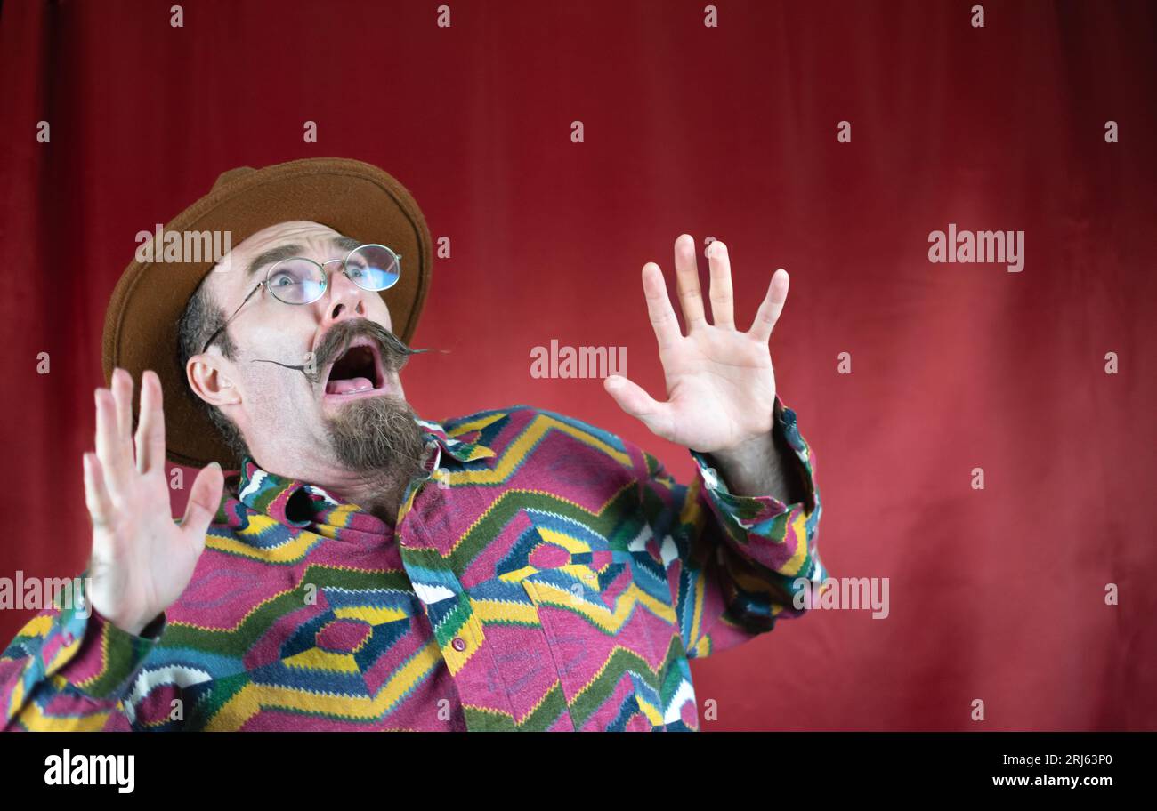 Vintage Hipster terrified man with mustache, hat, glasses and fear ...