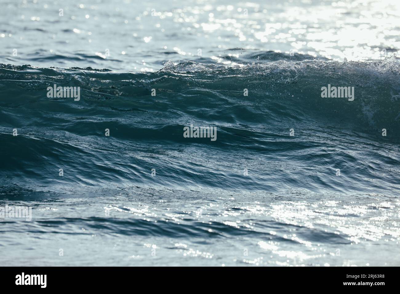 A blue ocean wave creating a soothing atmosphere Stock Photo - Alamy