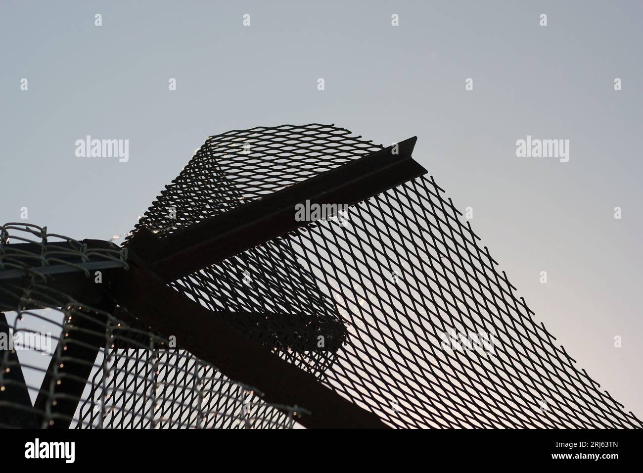 Industrial metal chain link fence with a typical repeating pattern ...