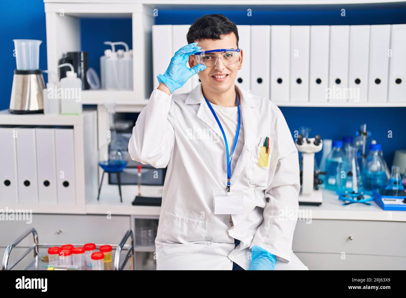Young non binary man scientist smiling confident at laboratory Stock Photo - Alamy