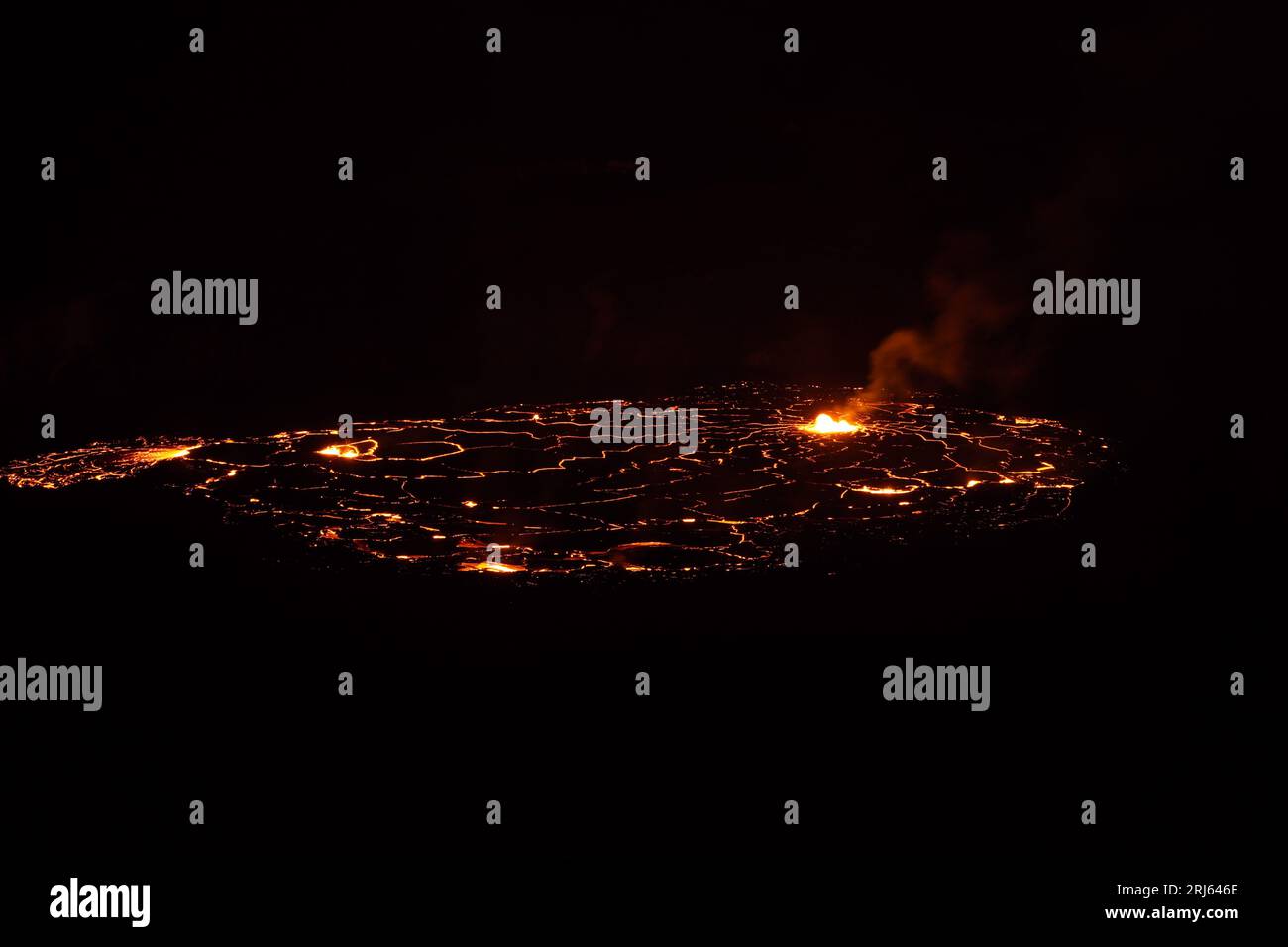 A stunning image of a volcanic eruption with a contrasting black and ...