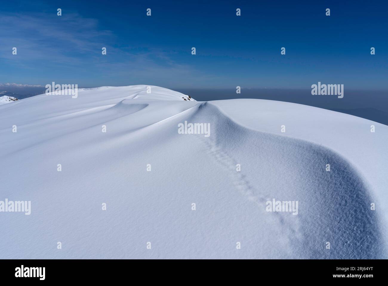 snowdrifts on top of the alpine mountain. snow dune lines, texture and ...