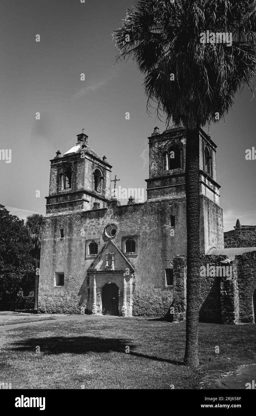 A grand building stands prominently in the foreground, adorned with a ...
