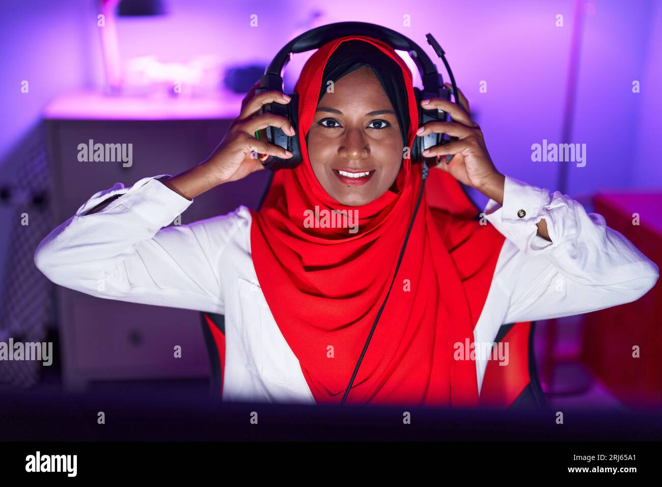 Young beautiful woman streamer smiling confident wearing headphones at ...