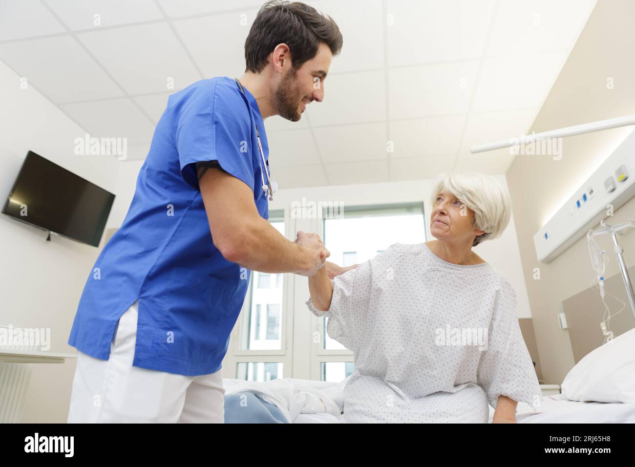 Helping patient stand hi-res stock photography and images - Alamy
