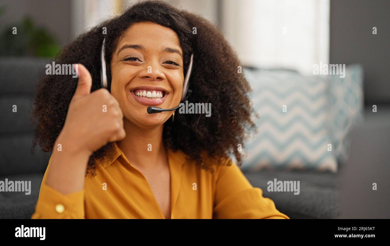African american woman call center agent doing thumb up gesture working ...