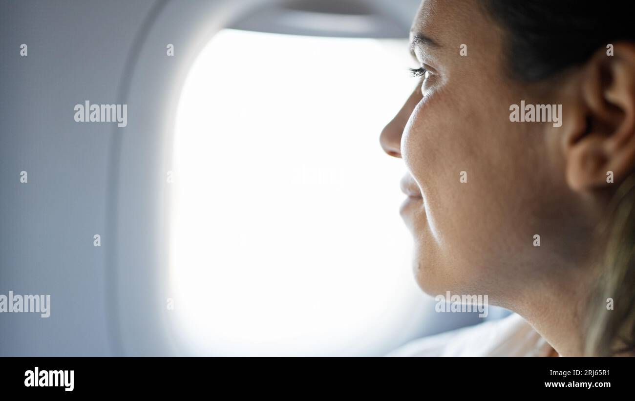 Beautiful young hispanic woman smiling confident looking throw the ...