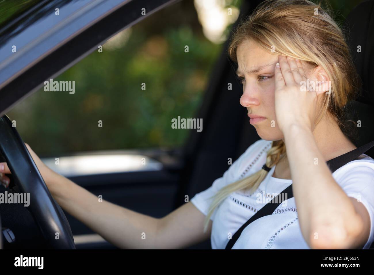 stressed woman driver sitting inside her car Stock Photo - Alamy