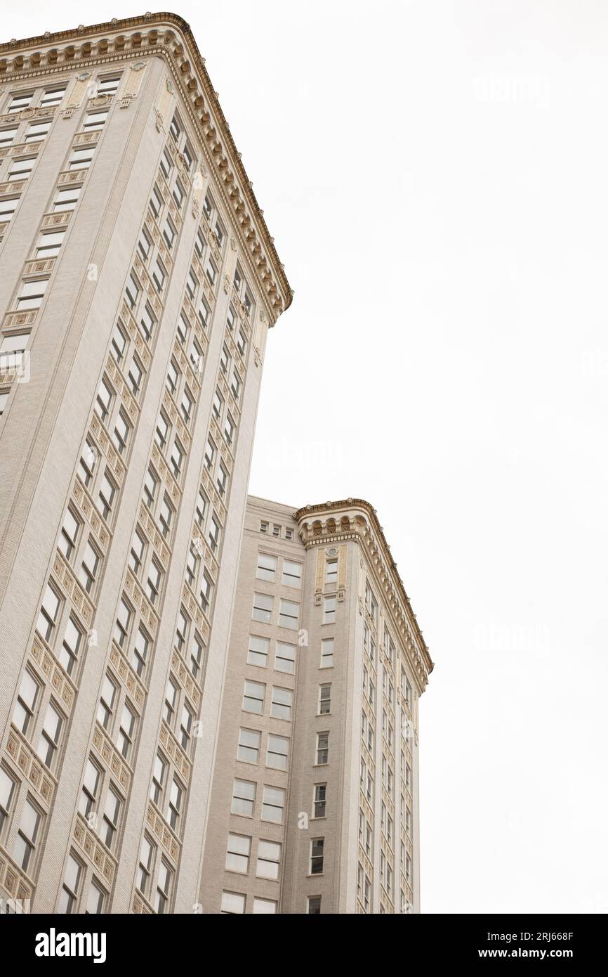 A vertical shot of tall historic buildings from Atlanta on a white ...