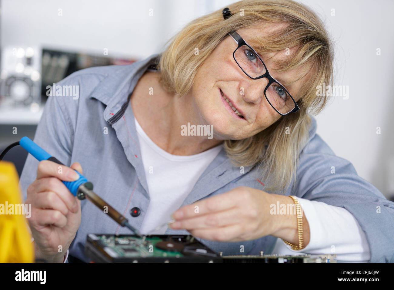 cute female engineer at home working on technology Stock Photo - Alamy