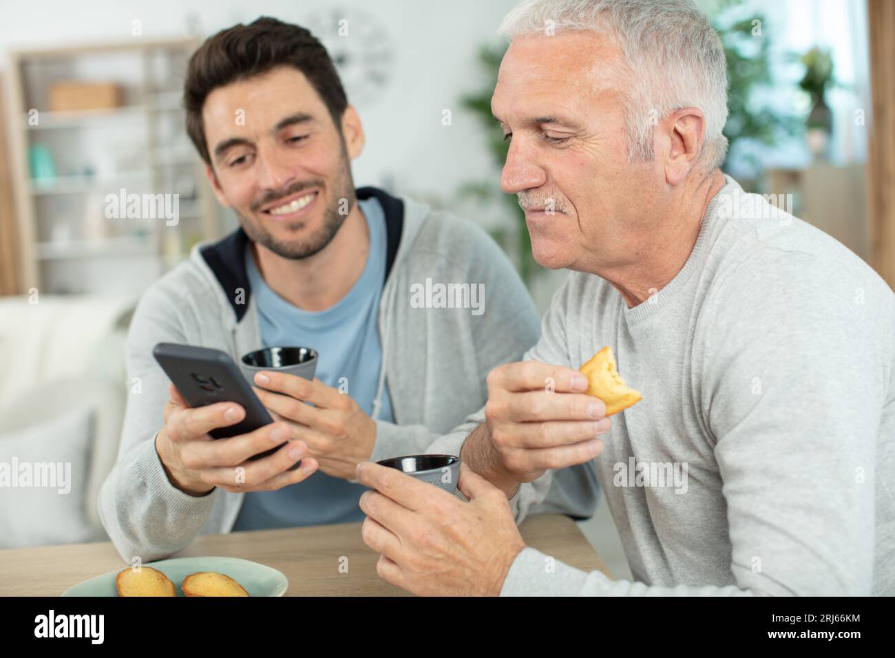 Father and grown up son hugging hi-res stock photography and images - Alamy