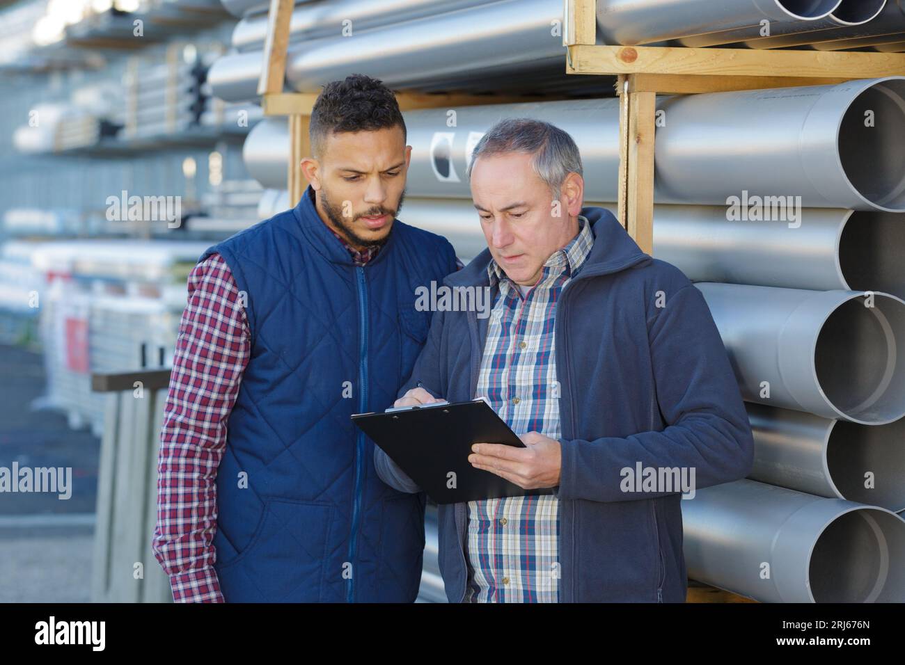 workers at a water pvc pipe Stock Photo - Alamy