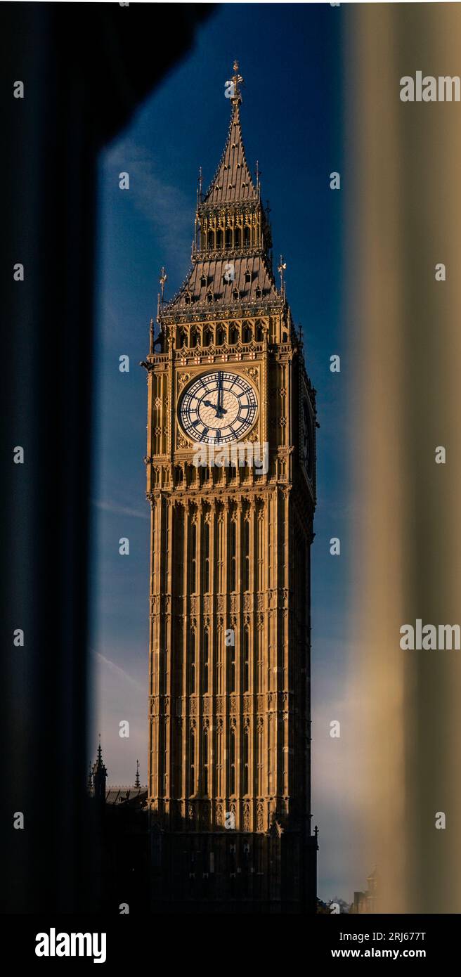 A vertical of Big Ben seen from a window in London, England, UK Stock ...