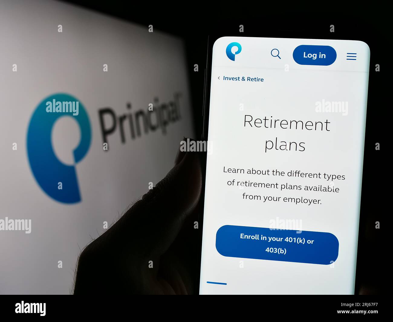 Person holding cellphone with webpage of US company Principal Financial ...