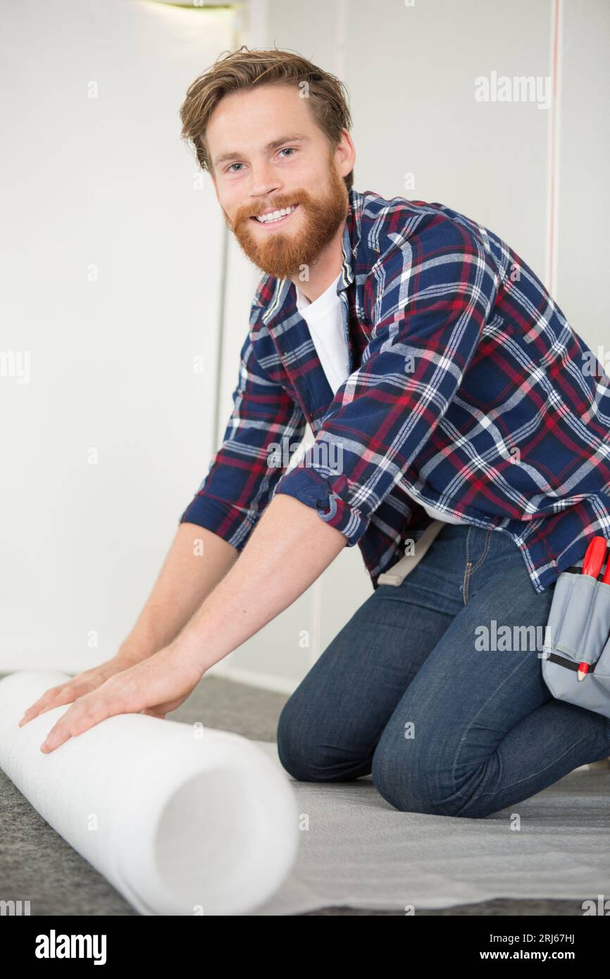 Man laying carpet hi-res stock photography and images - Alamy
