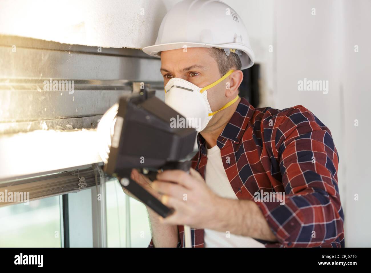 window installation worker with mask Stock Photo - Alamy