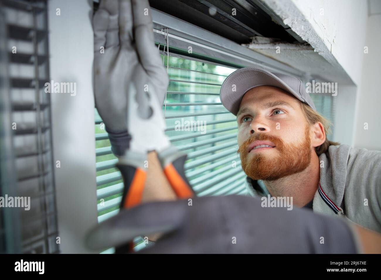 Installing window blinds hi-res stock photography and images - Alamy