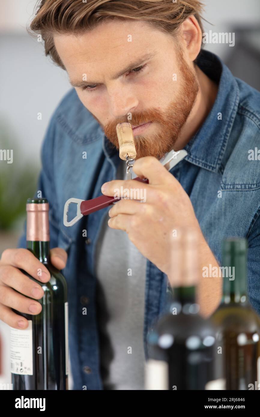 Man sniffing cork hi-res stock photography and images - Alamy