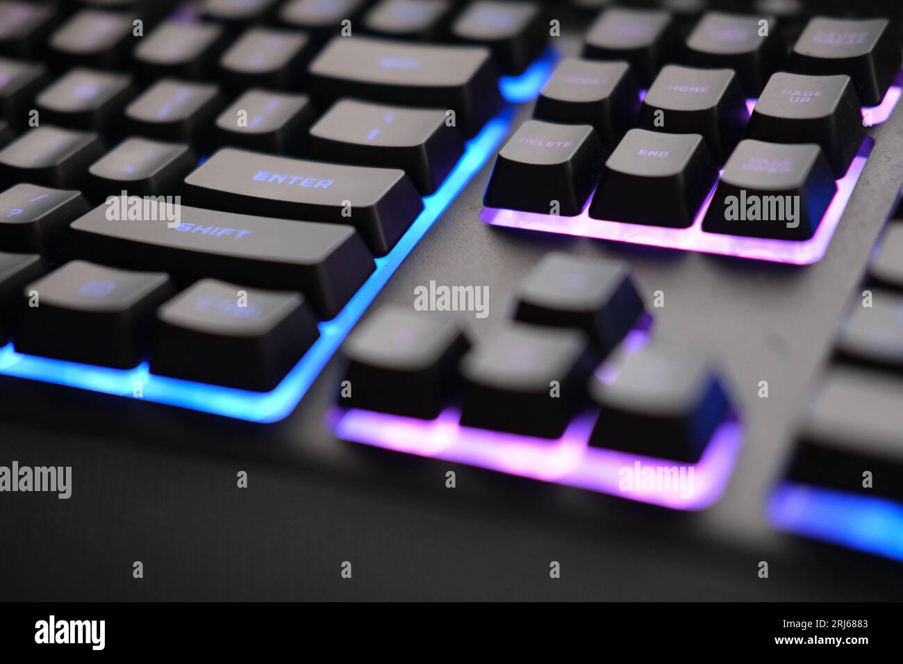 An illuminated computer keyboard featuring keys lit up in alternating ...