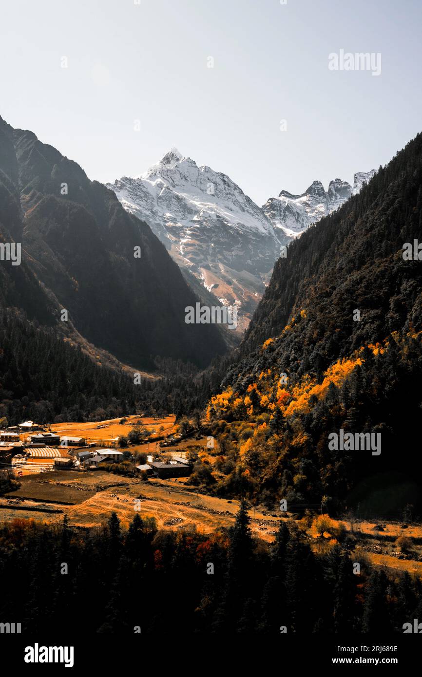 A picturesque view of a tranquil valley surrounded by towering ...